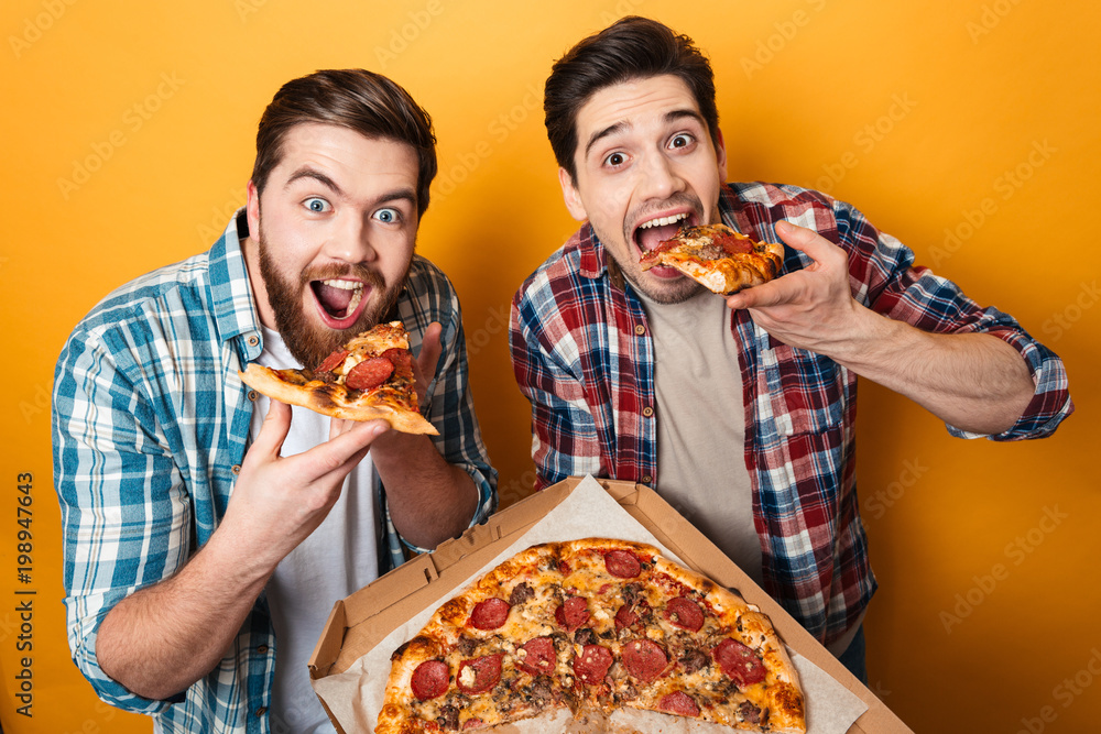 Two People Eating Pizza