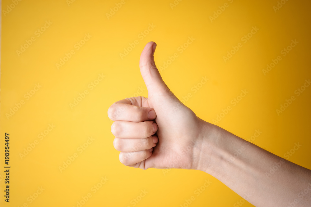 emale hand showing thumbs up gesture Stock Photo | Adobe Stock