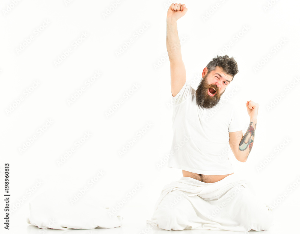 Man stretching and yawning, waking up, sit on floor Stock Photo | Adobe ...
