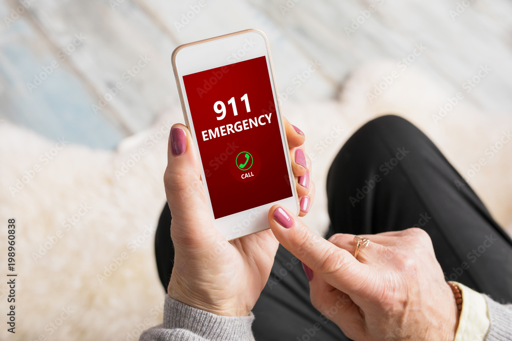 Old person dialing emergency number 911 on phone Stock-Foto | Adobe Stock