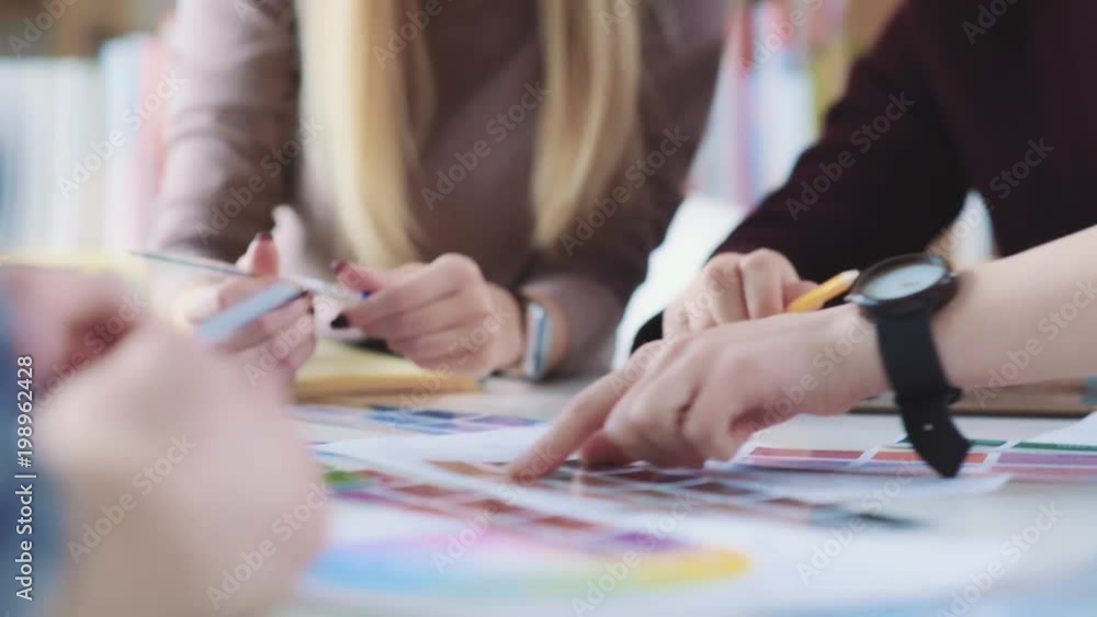 The creative group chooses a shade, a color scheme, looking at a ...