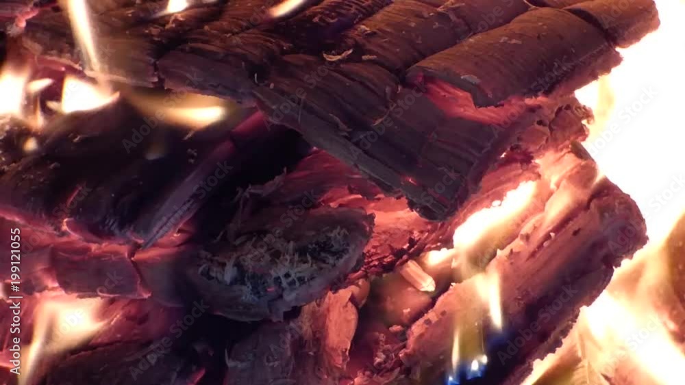 Fire background - red hot glowing charcoals inside stove. Ashes moving ...