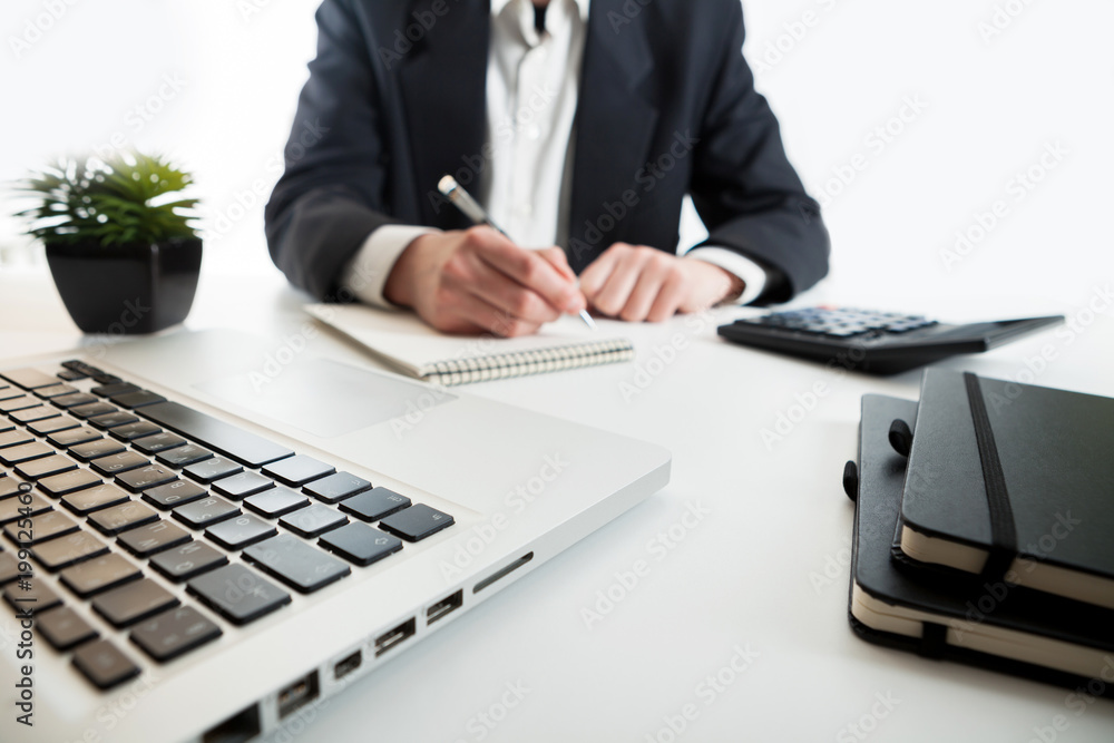 Close up view of bookkeeper or financial inspector hands making report ...