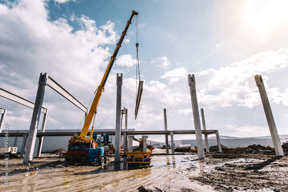 Process of unloading cargo using crane, industrial cement cast ...