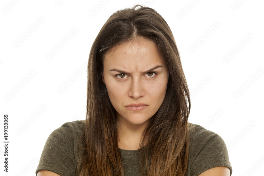 Beautiful angry woman without makeup on white background Stock Photo ...