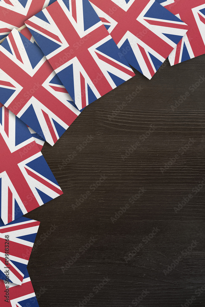 small British flags framing a wood texture background with copy space ...
