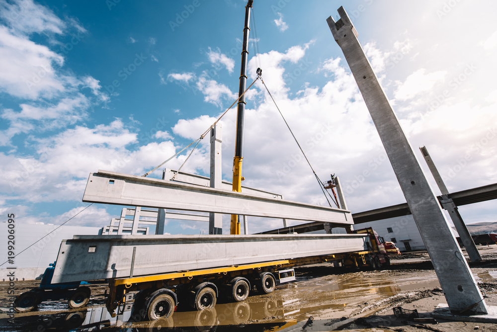 wide angle view of industrial heavy duty crane installing precast ...