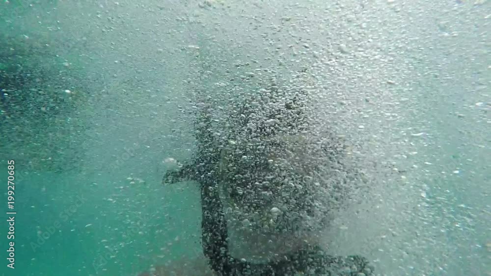 man in dive mask jump in into water from the boat for snorkelling ...