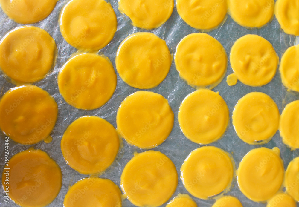 dried mango sheet on stanless table, thai sweet dessert. Stock Photo ...