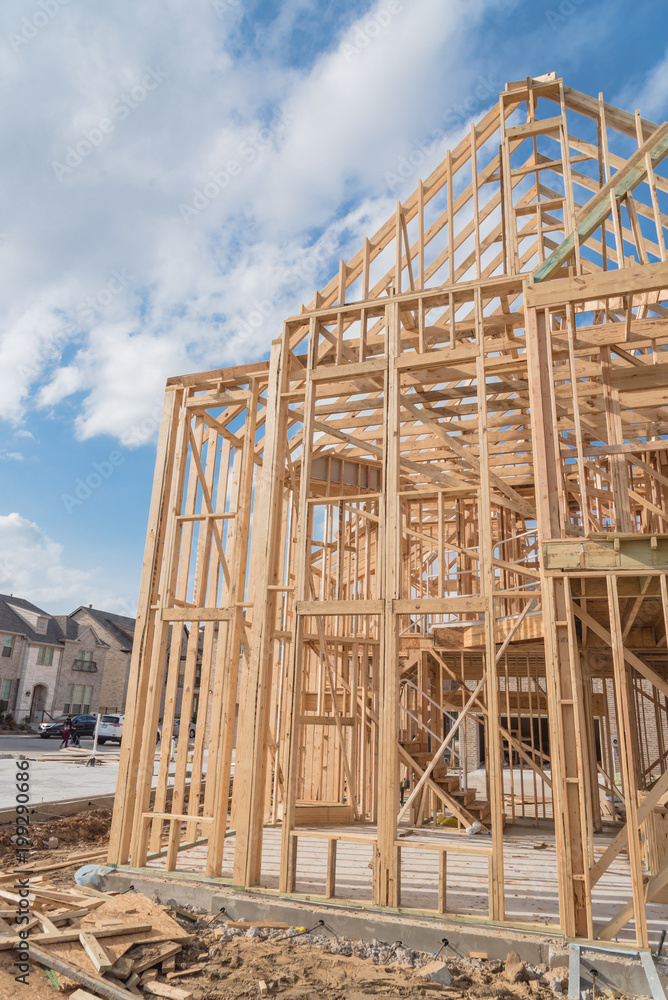 Close-up single-family timber frame house with slab-on-grade concrete ...