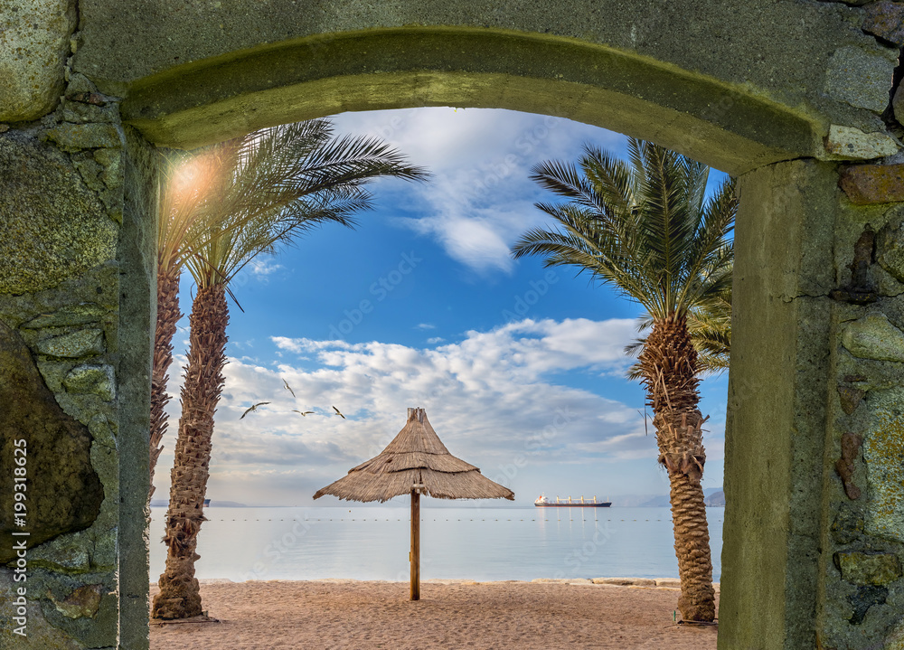 Composite image with arch and public beach in Eilat - Israeli ...