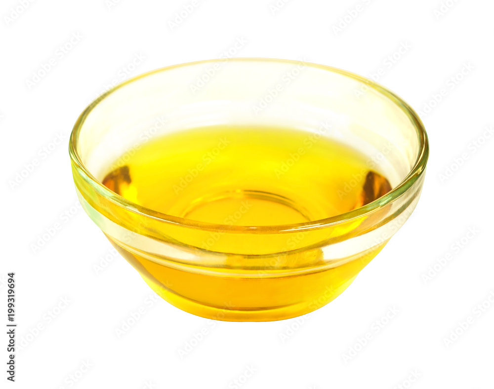 Side view of vegetable transparent golden oil in glass bowl isolated on ...