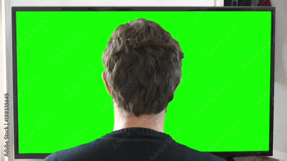 Man Watching Tv Television Green Screen. Young man watching big green ...