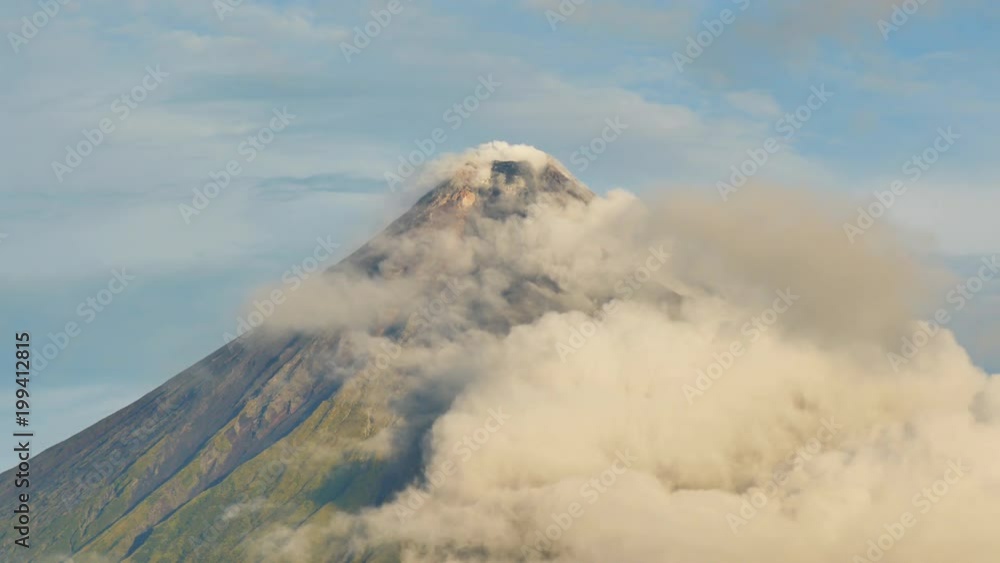 Mount Mayon Volcano in the province of Bicol, Philippines. Clouds ...