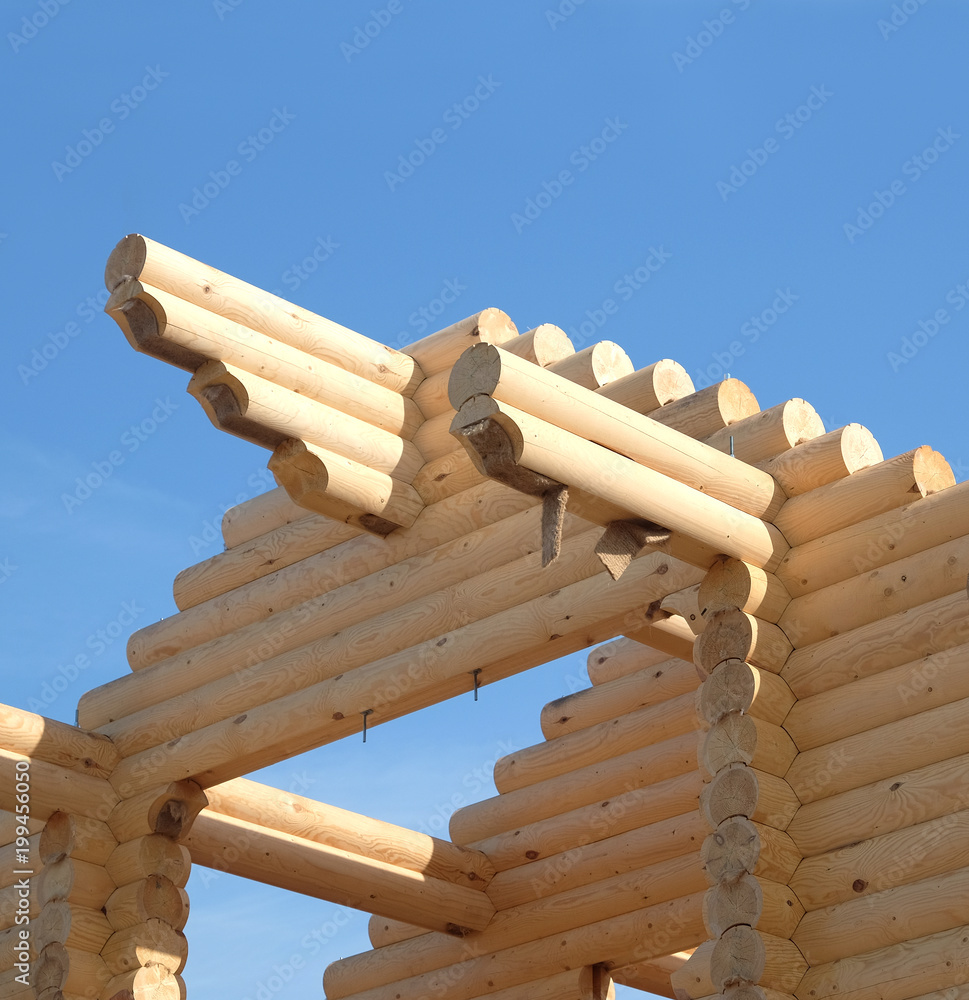 Top of rural wooden house from sandy brown smooth planed heavy pine ...