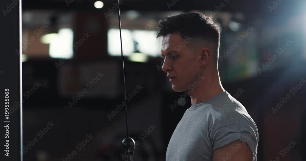 Portrait young man in the gym fitness body strength exercise fit health ...