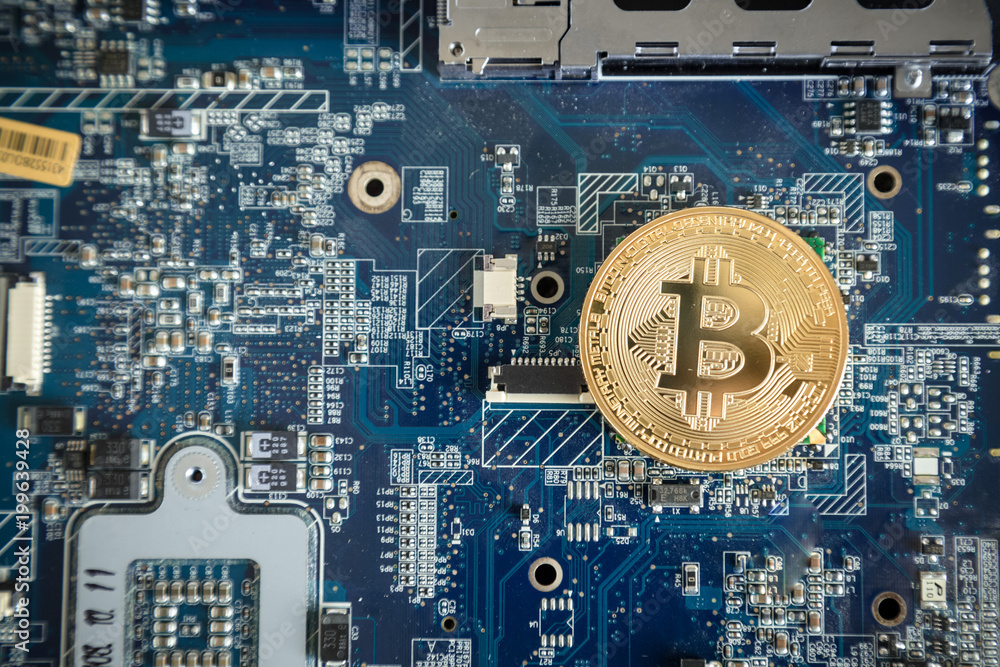 Top Down Gold Digital Cryptocurrency Coin on Computer Motherboard ...