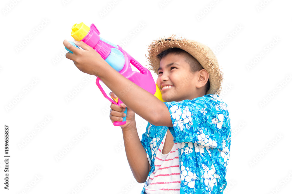Cute boy playing water gun on white background, Songkran Festival in ...