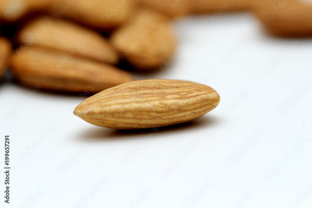 Almond mamra giri isolated. Group of almond nuts isolated on white ...