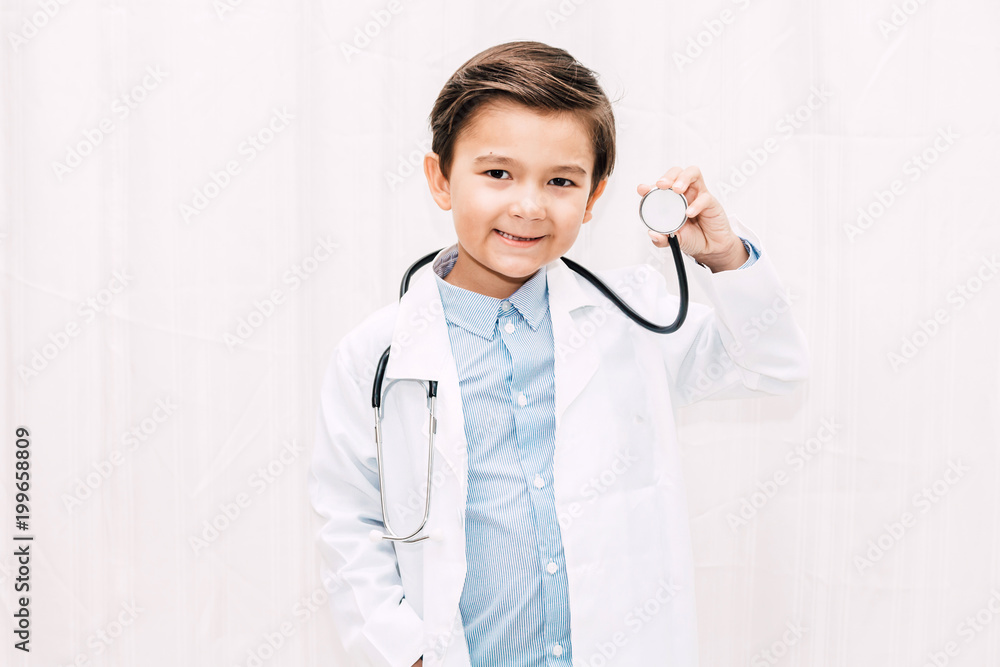 Little doctor with a clothes of doctor and stethoscope Stock Photo ...