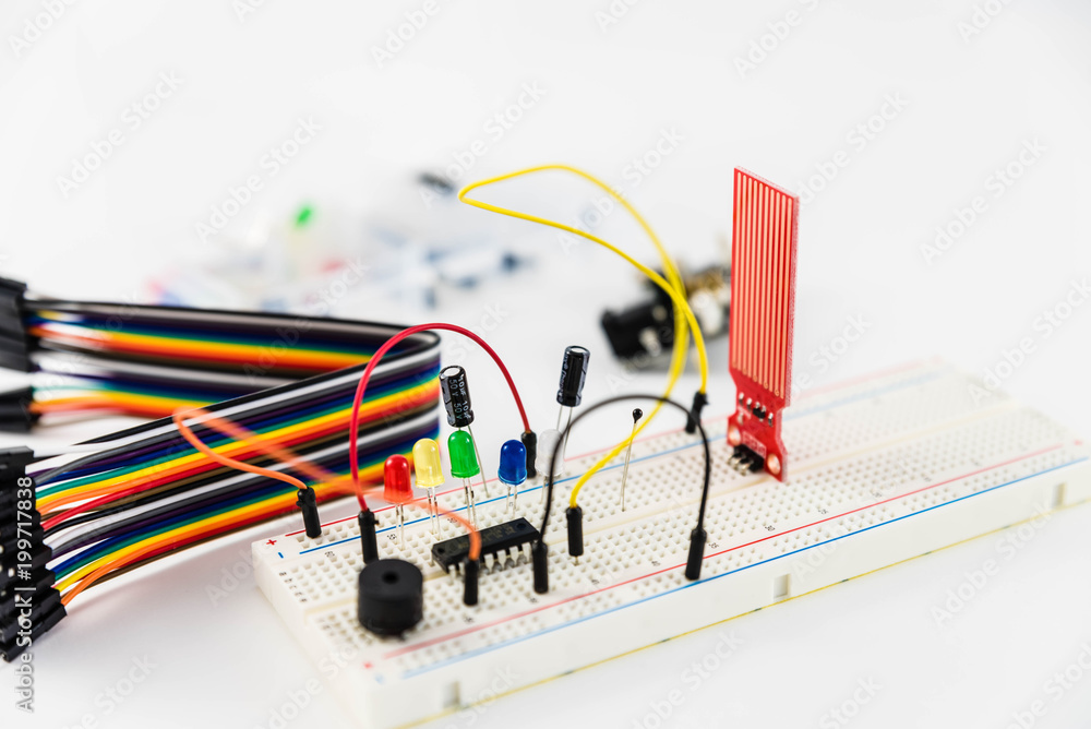 Microcontrollers, chips, resistors and light-emitting diodes on white ...