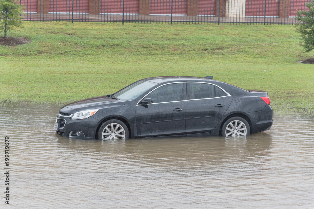 Black sedan car swamped by flood water in East Houston, Texas, US by ...