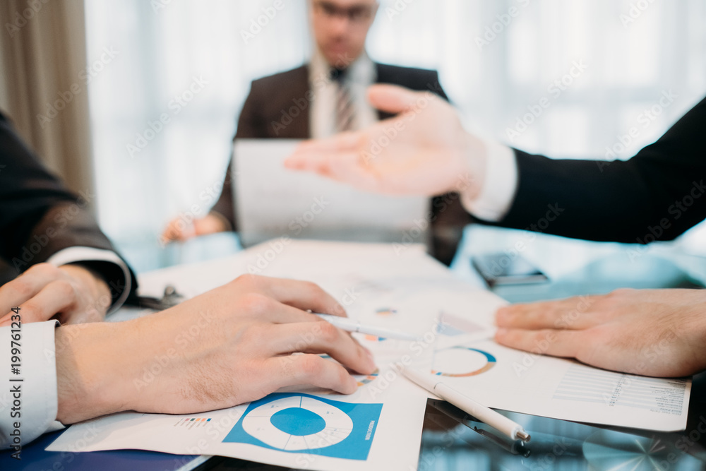 business team discussion. financial statistics review. coworkers ...