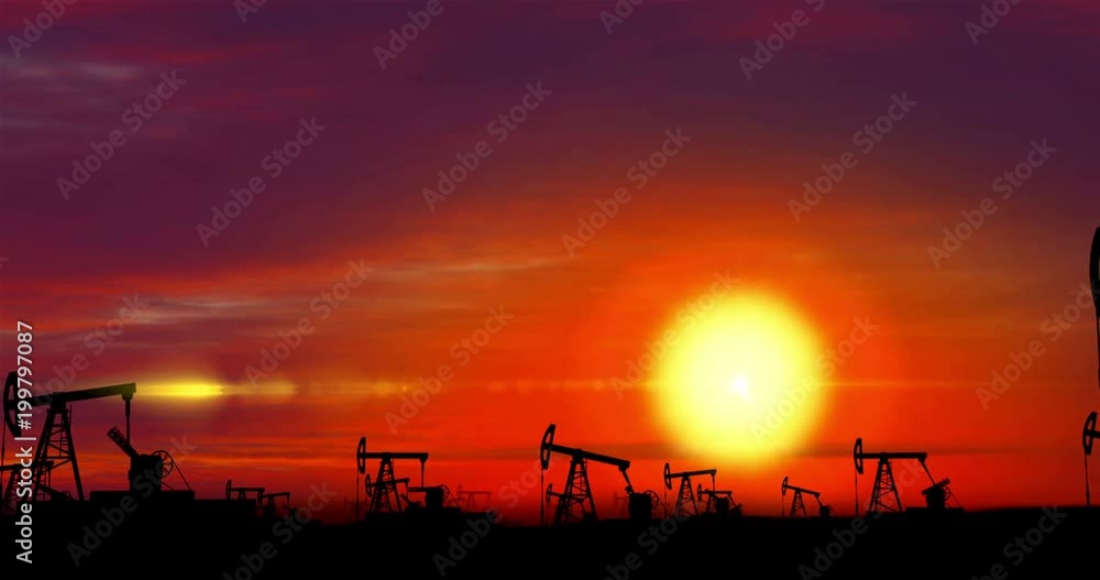 Oil pumps silhouettes working on clouds and sun in background. Flight ...
