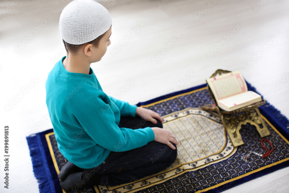 Little Muslim boy praying, indoors Stock Photo | Adobe Stock