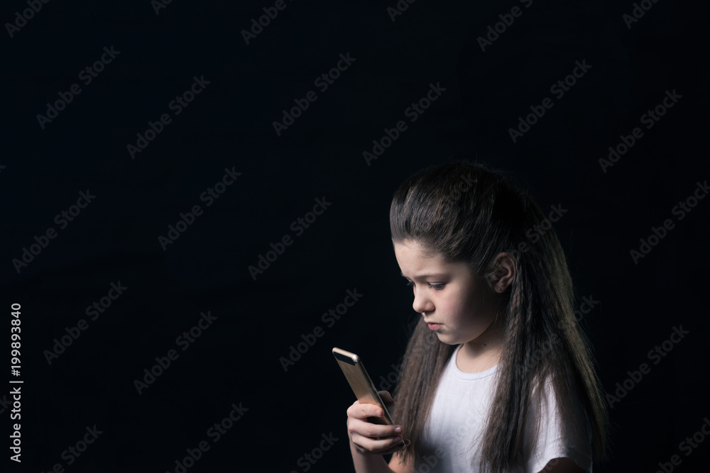 young sad vulnerable girl using mobile phone scared and desperate ...