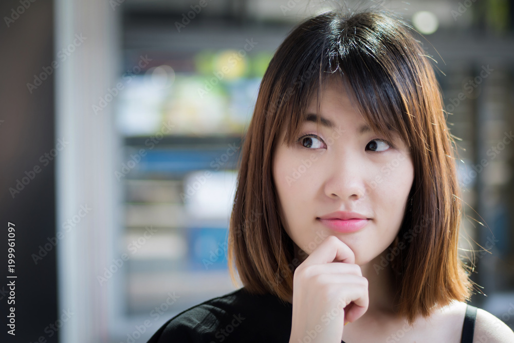 smart thoughtful woman thinking, planning; portrait of asian woman ...