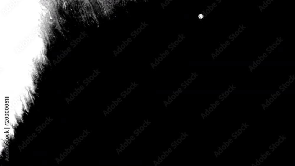 Black ink spreading on white background with an amazingly detailed ...