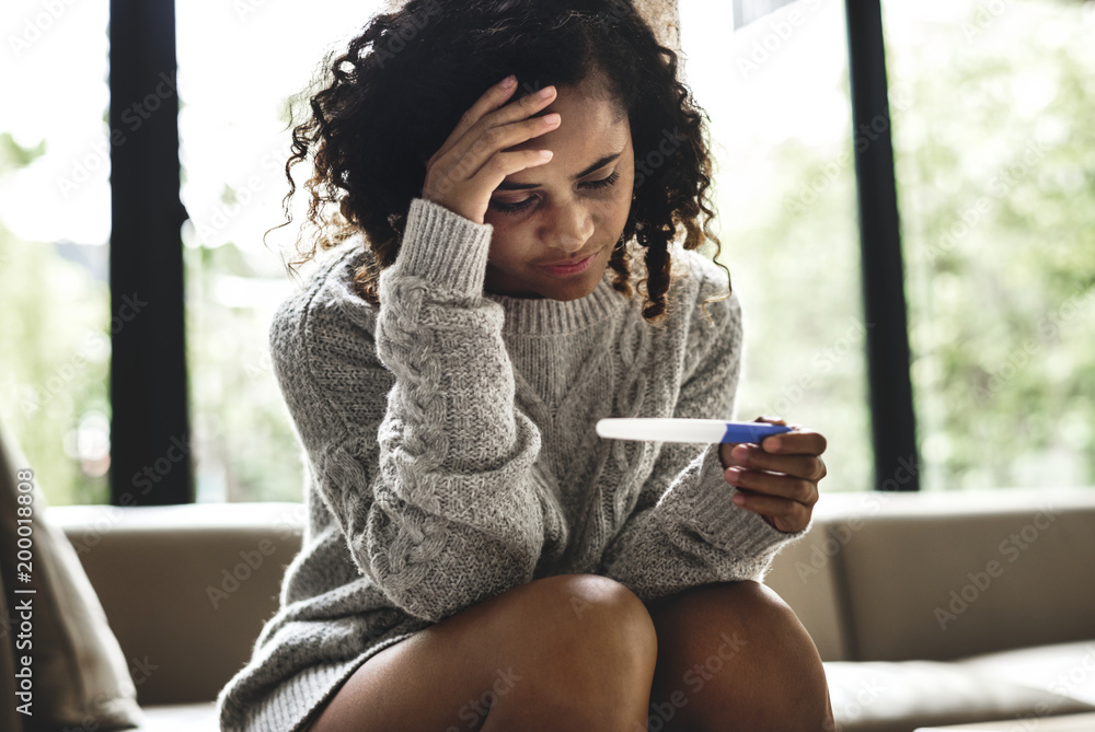 Woman with a pregnancy test Stock Photo | Adobe Stock