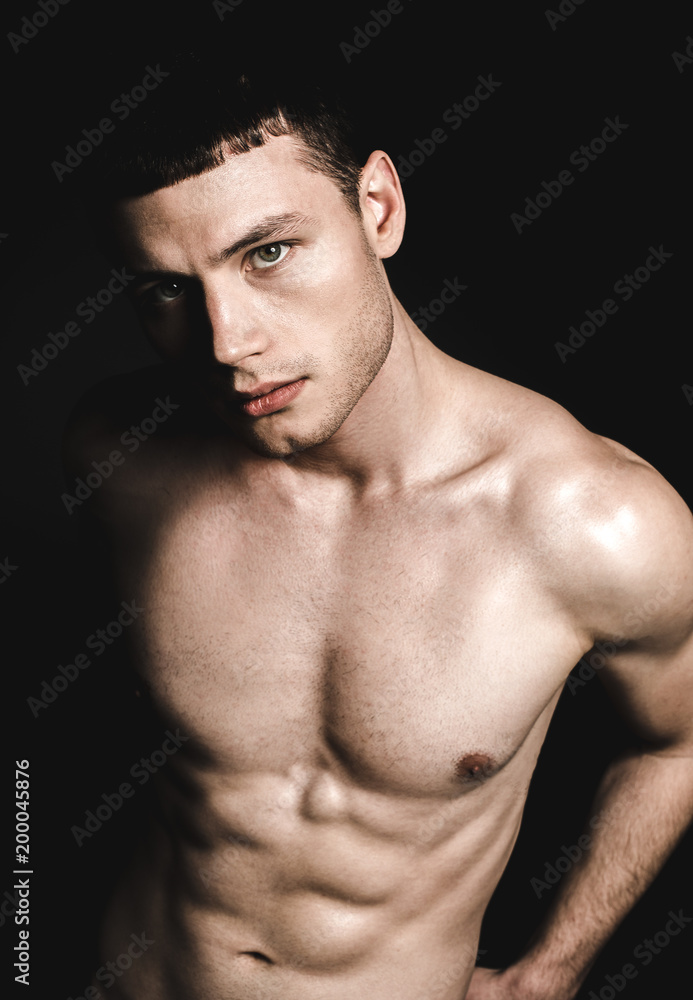 Portrait of relieved male stripped to waist looking at camera. Unmoved ...