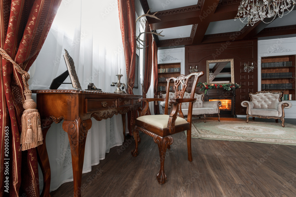 Old studying room with fabric armchairs and wooden table. Classic ...