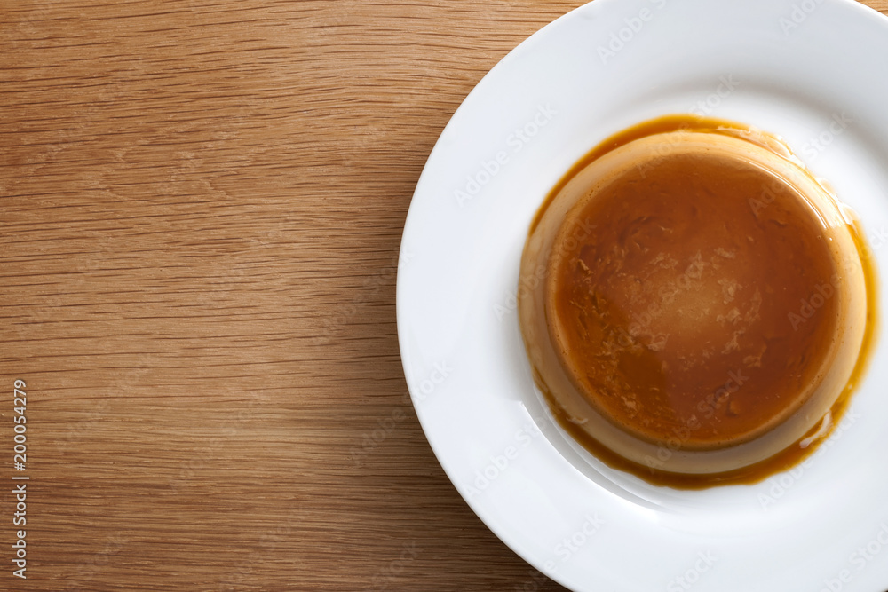 French dessert and sweet snack concept with top view of a creme caramel ...