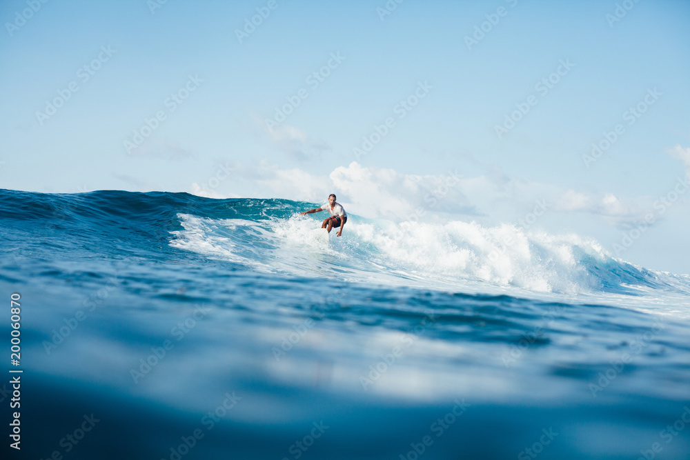 handsome athletic man surfing on ocean wave Stock Photo | Adobe Stock
