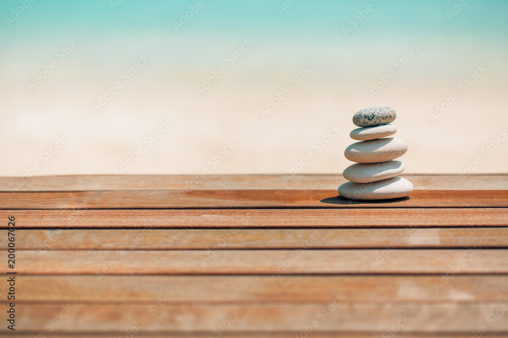 Zen stones on relaxing beach background. Calmness and motivational ...