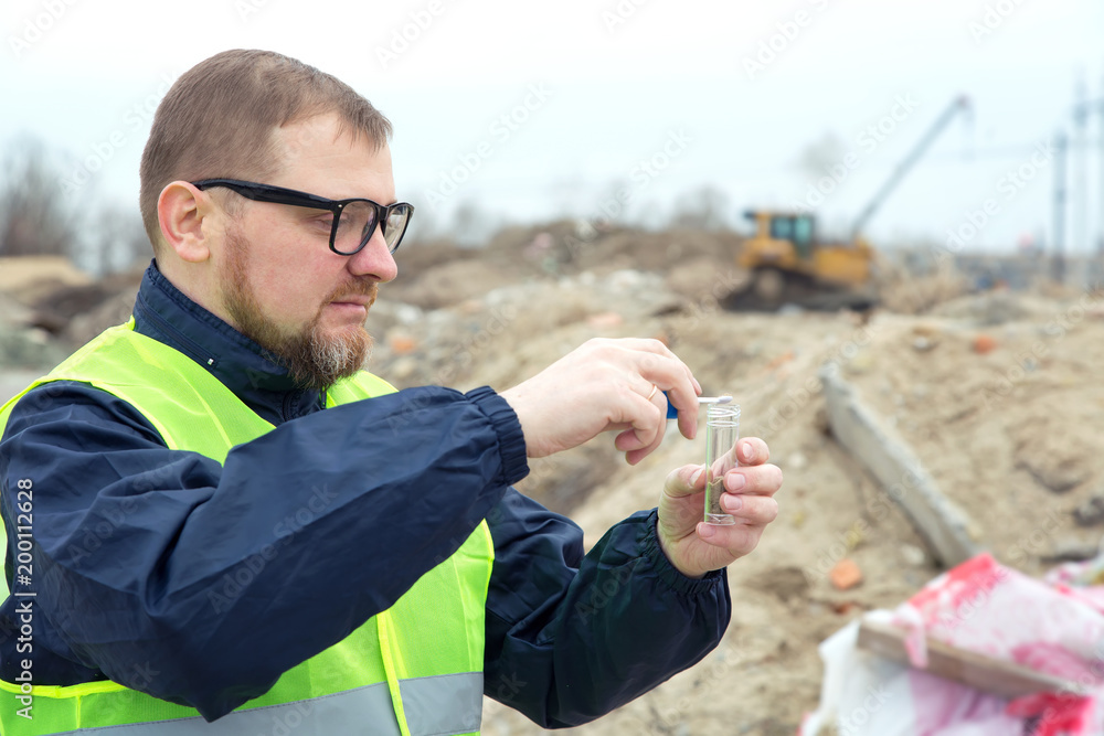 Adult man the ecologist. He studies the problems of ecology arising ...