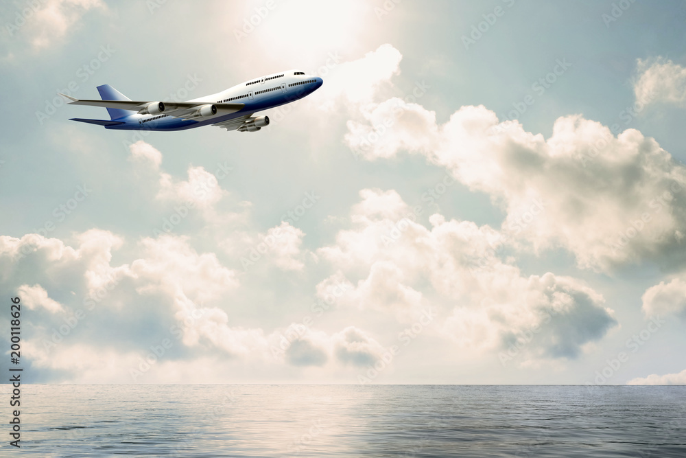 Commercial airplane flying over water. Stock Photo | Adobe Stock