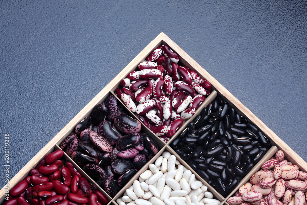 Different types of legumes beans. In wooden box.Varieties of beans.Top ...