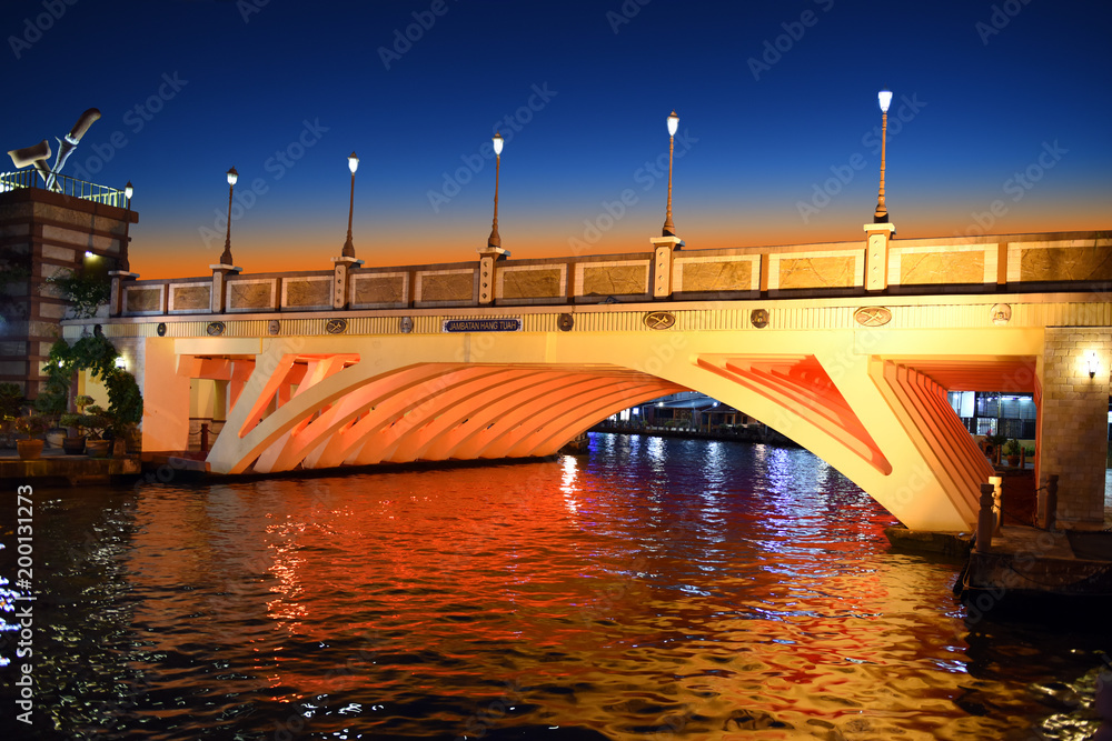 Melaka river and Jambatan Hang Tuah bridge in the night with colorful ...