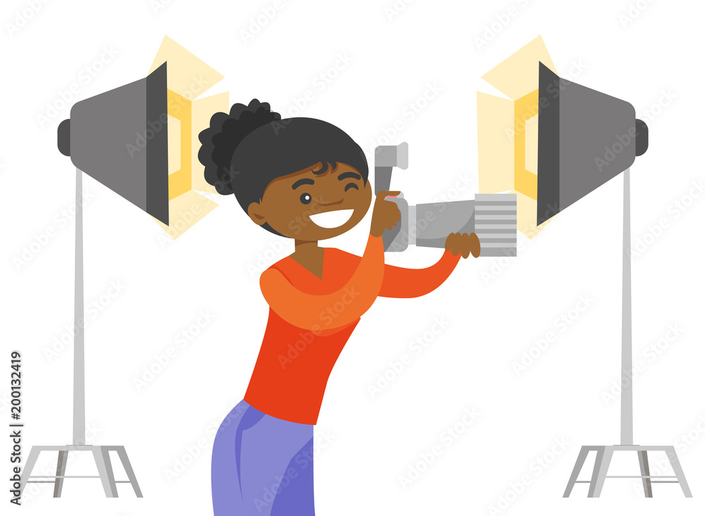 Young african-american photographer holding a camera in photo studio ...