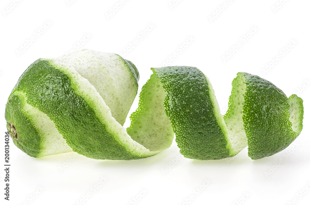 Lime fruit and its rind cut out in spiral form, white background Stock ...