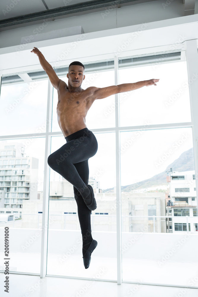 Male ballet dancer dancing in studio Stock Photo | Adobe Stock