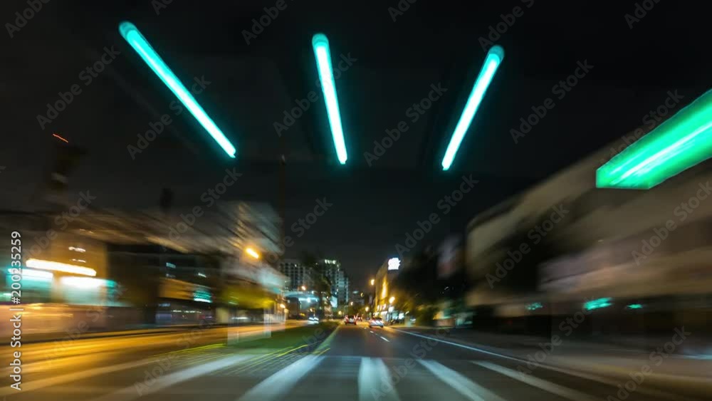 Night time car traffic time lapse. Driving through Miami streets ...
