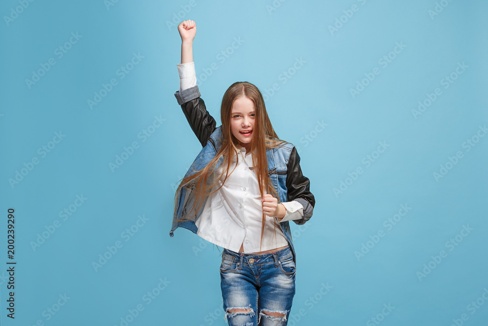 Happy success teen girl celebrating being a winner. Dynamic energetic ...