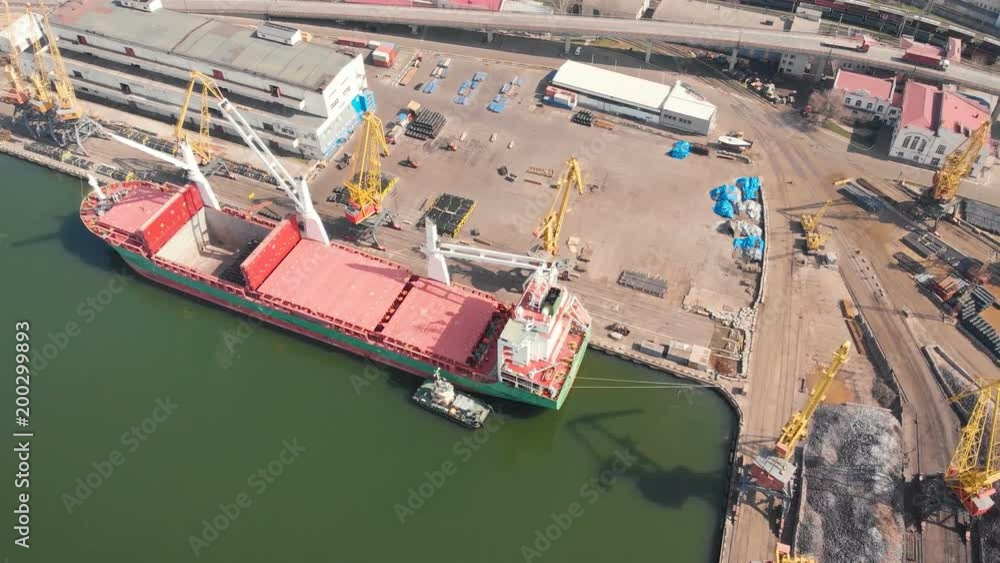 Aerial view of the ship's loading near the berth in the cargo port ...