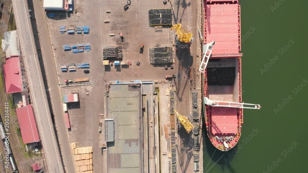 Aerial view of the ship's loading near the berth in the cargo port ...
