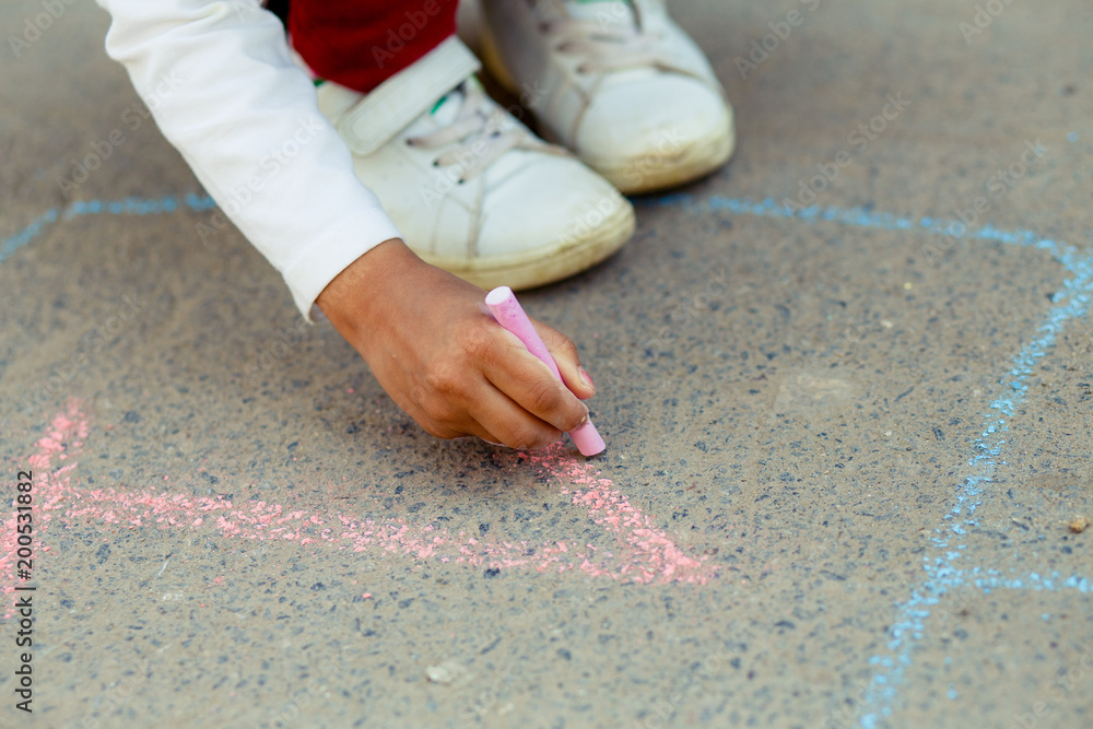 Hopscotch in a schoolyard on an asphalt floor with chalk drawings of ...